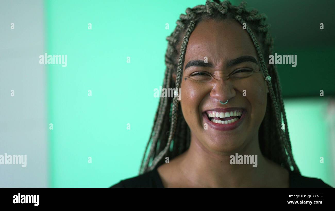 One happy Brazilian woman laughing and smiling portrait hispanic black ...