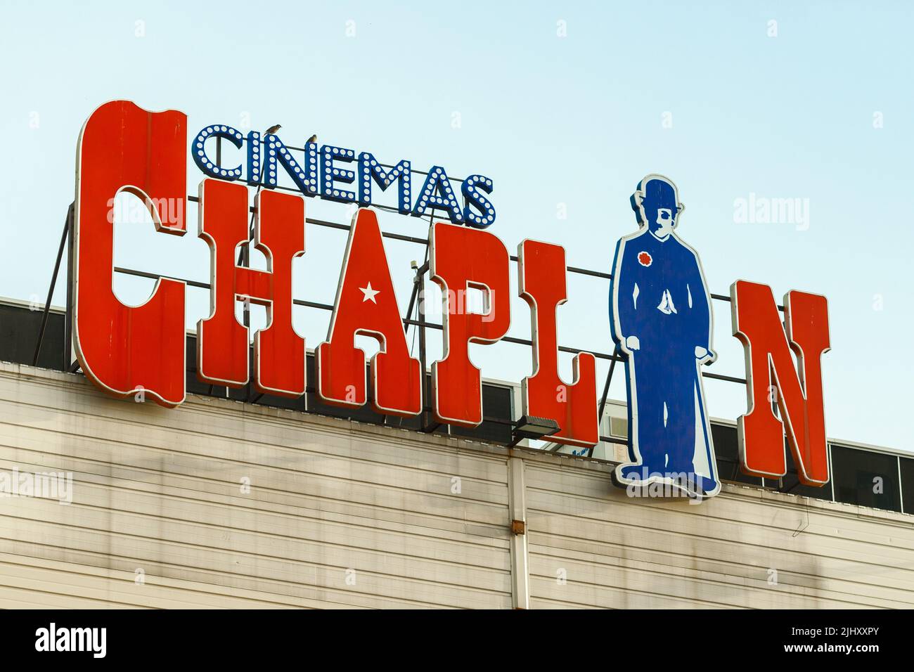 The logo of the Chaplin Cinema chain of cinemas on the building of a ...