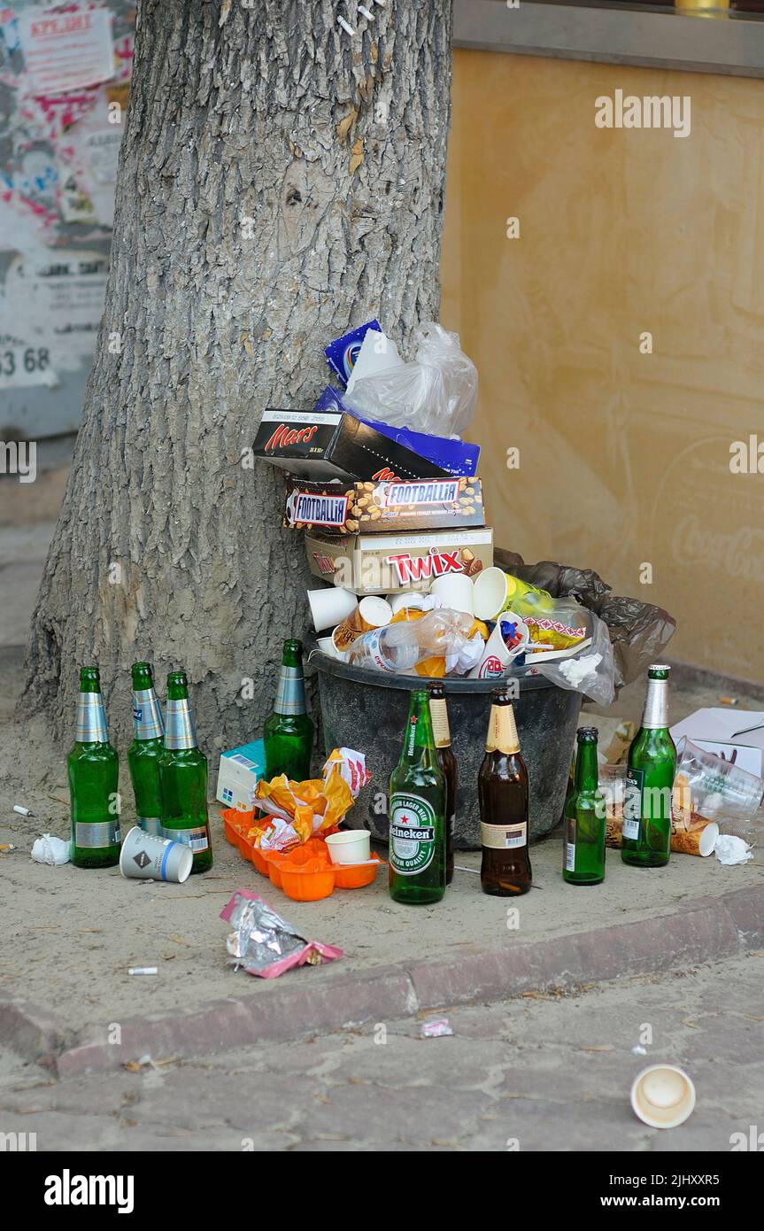 Golden age of consuming. Pile of garbage. Overflowing trash can on a ...