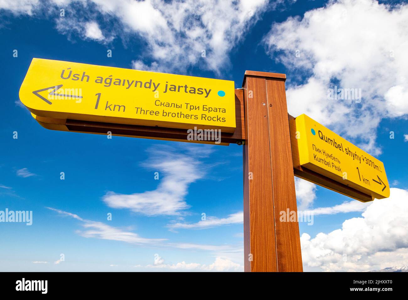 Signpost with directions towards the peak of the 3 brothers and peak ...