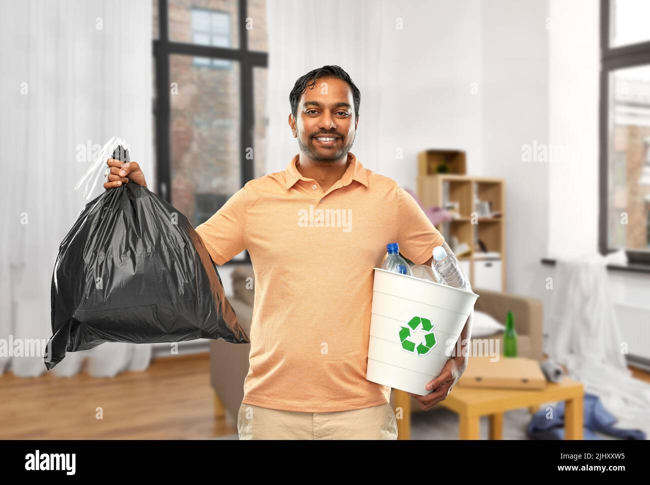 smiling indian man sorting paper and plastic waste Stock Photo - Alamy