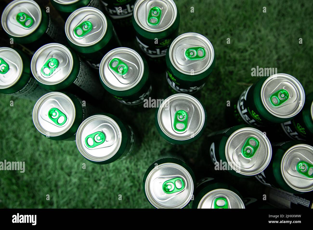 Top view of green carlsberg beer cans on green lawn Stock Photo - Alamy
