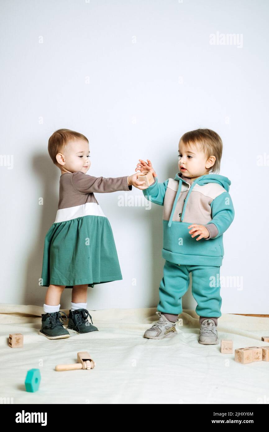 Baby fashion. Unisex gender neutral clothes for babies. Two Cute baby ...