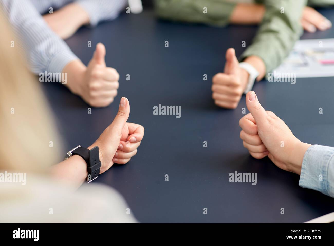 Group businesspeople showing sign hi-res stock photography and images ...