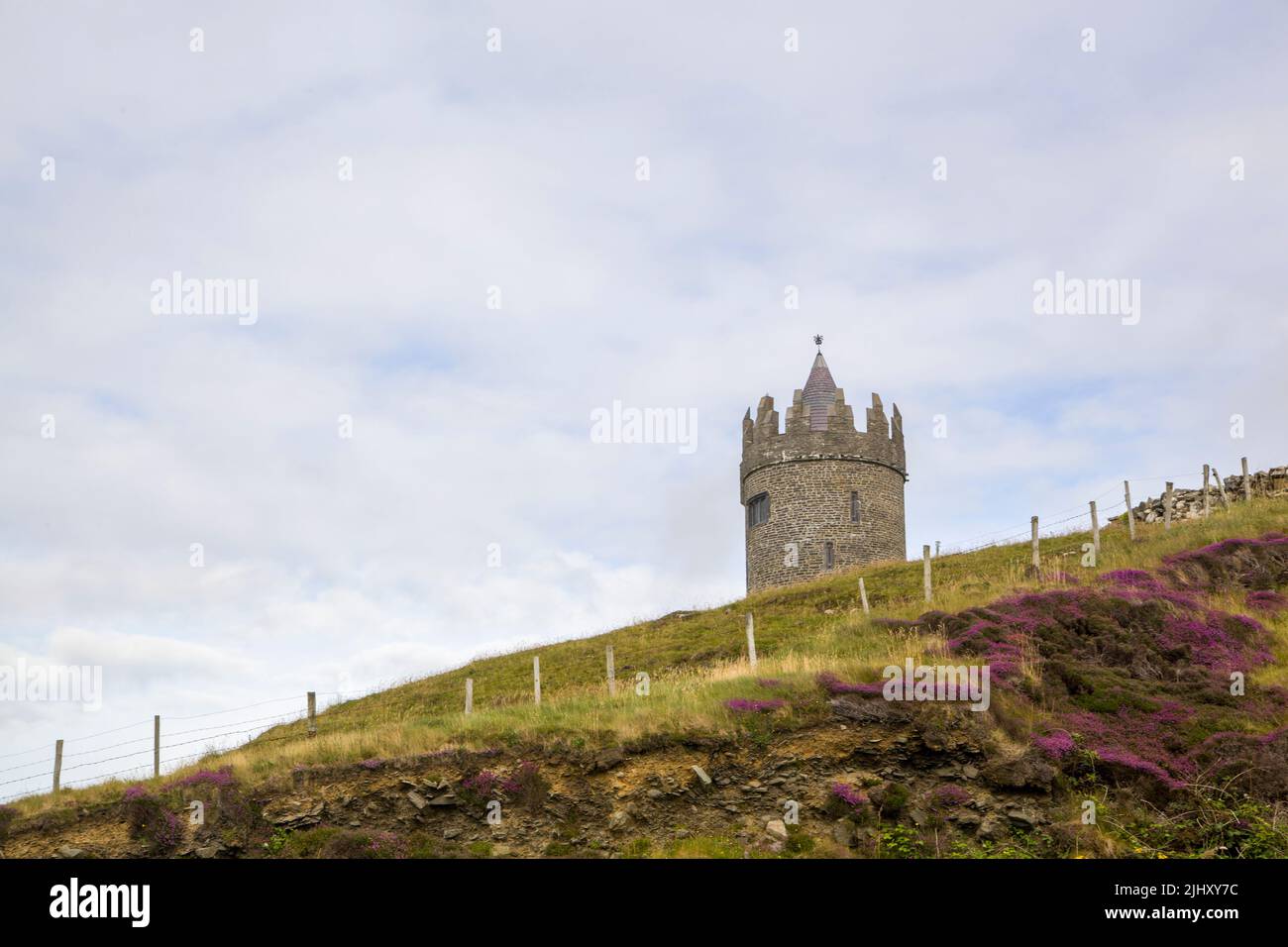 Slope in the foreground and a tower of a castle in the background in ...