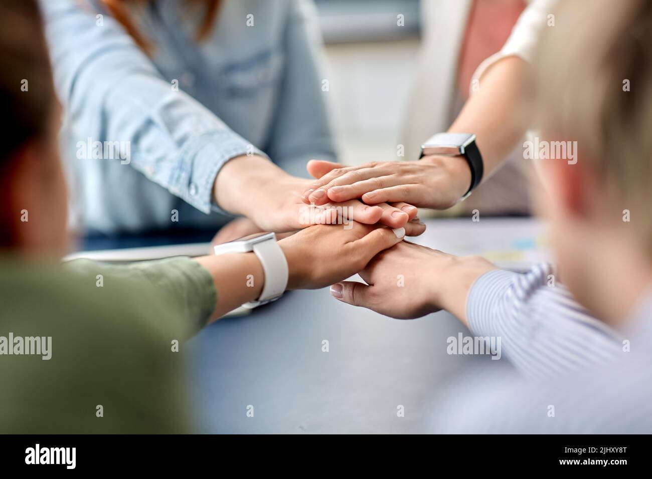 Group businesspeople stacking hands hi-res stock photography and images ...