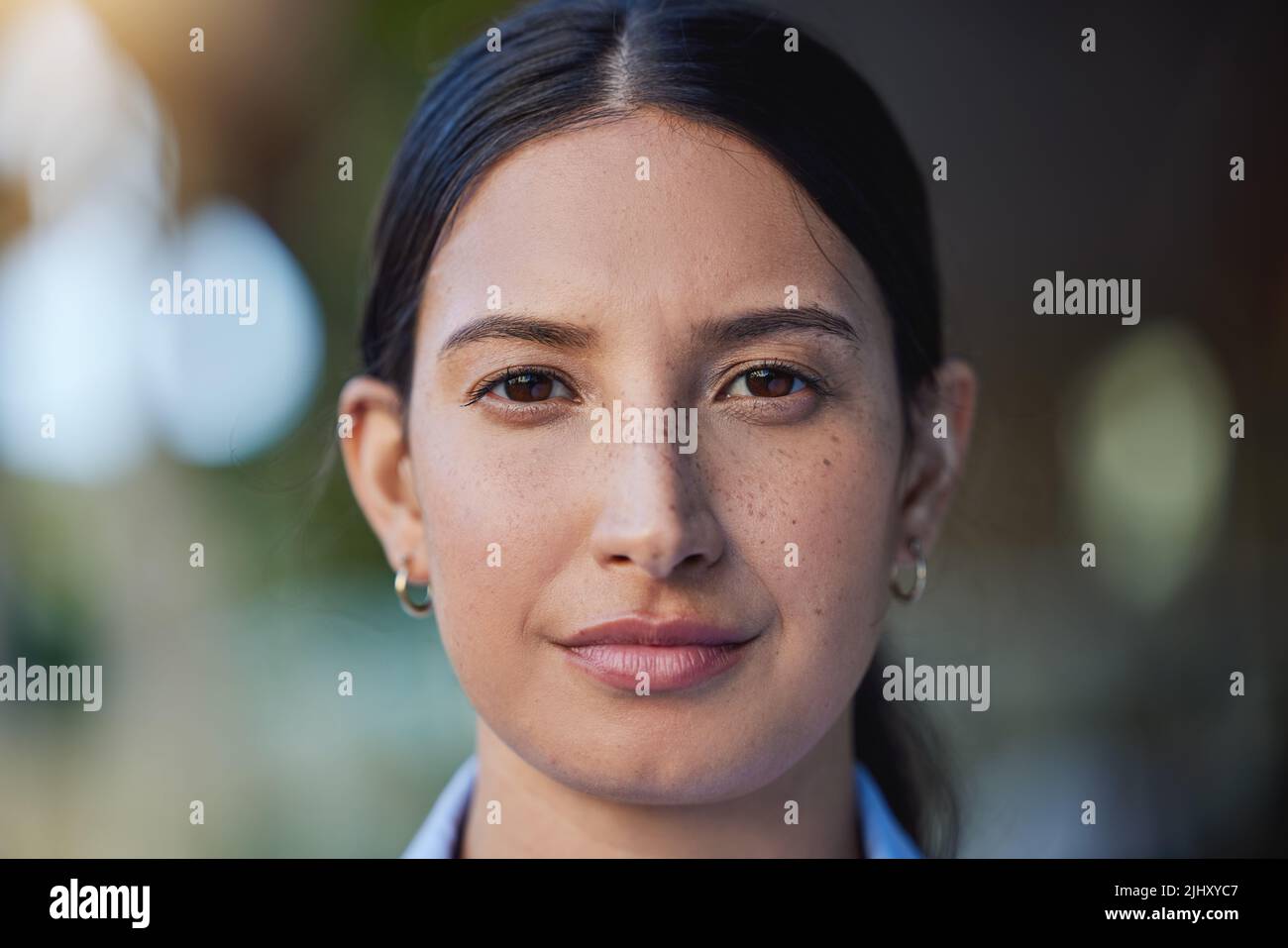 Closeup portrait of mixed race womans face and eyes looking forward and ...