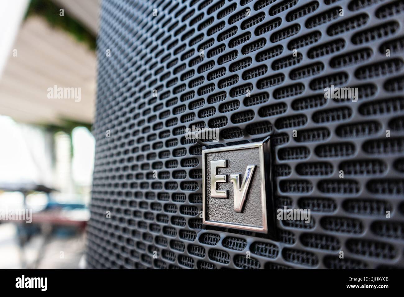 Close-up of the EV Electro Voice logo on large speakers set up at a ...