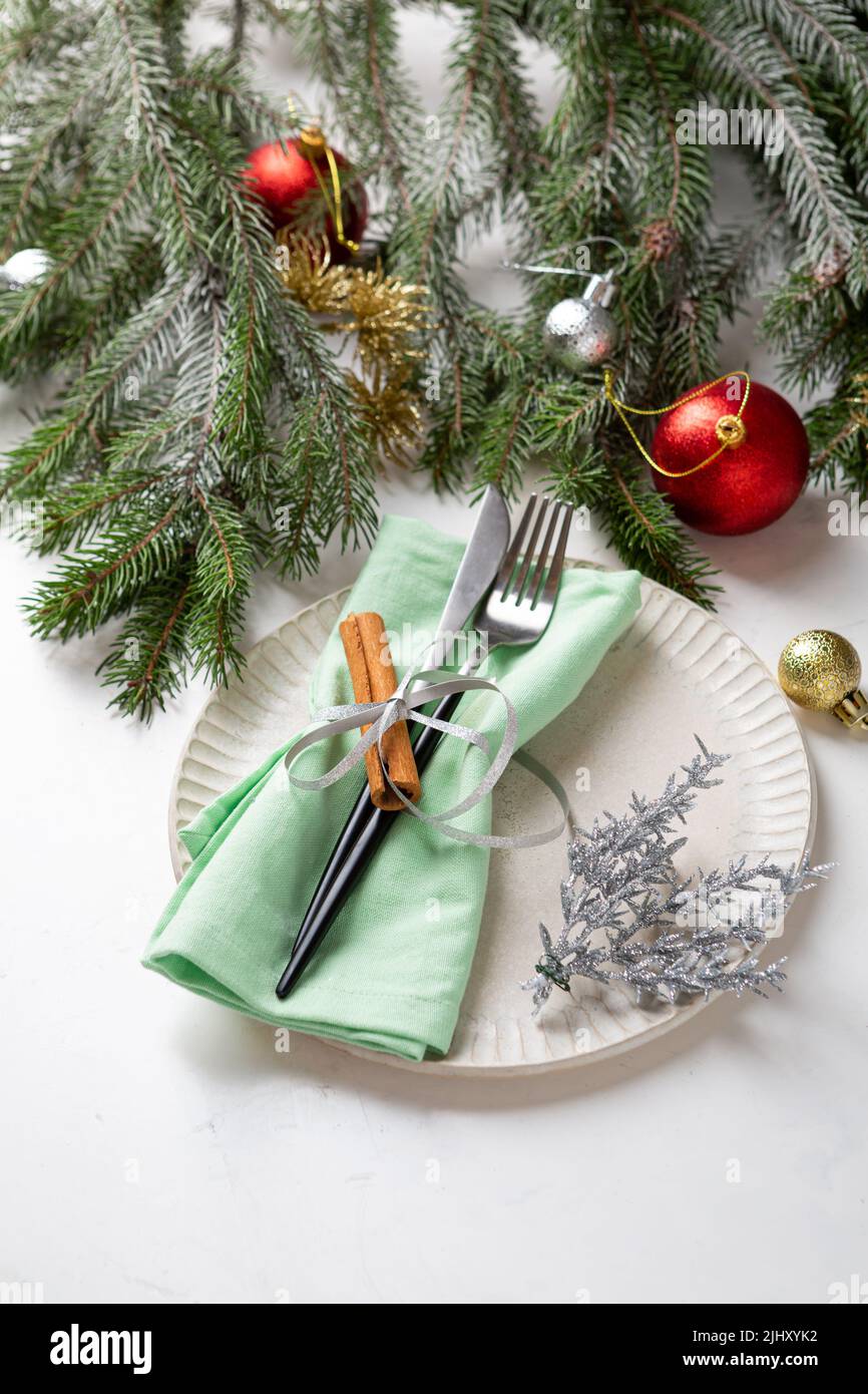 Christmas dinner table setting concept plate decorations green eve tree ...