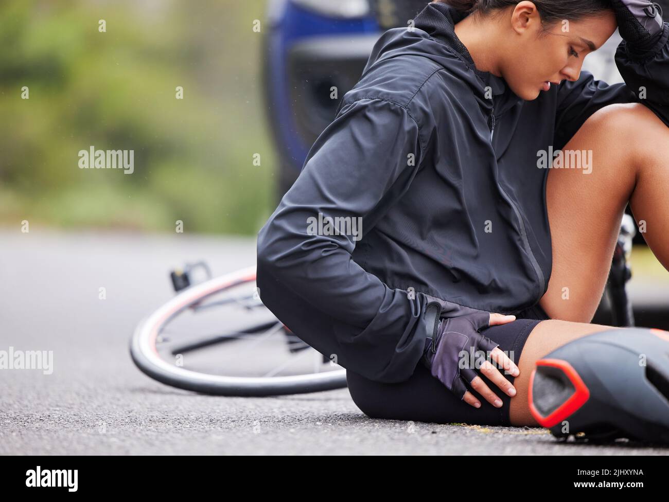 Beautiful, athletic, mixed race young woman suffering with injury while ...