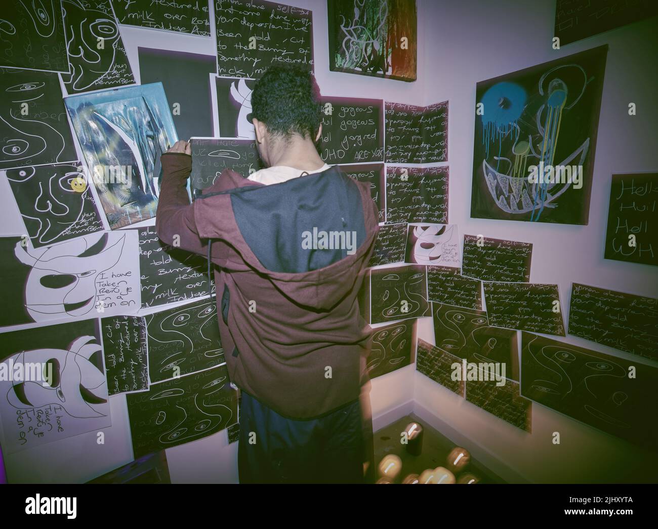 Rear shot of an unknown man with mental disorder standing alone at ...