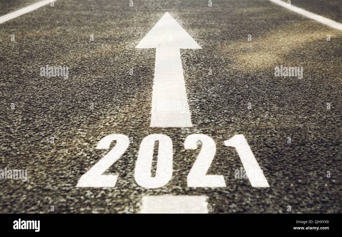white road marking in shape of 2021 year and arrow Stock Photo - Alamy