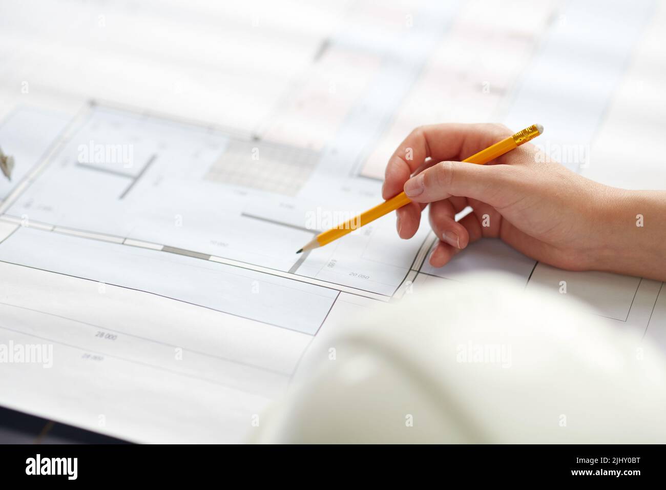 architect with blueprint working at office Stock Photo - Alamy