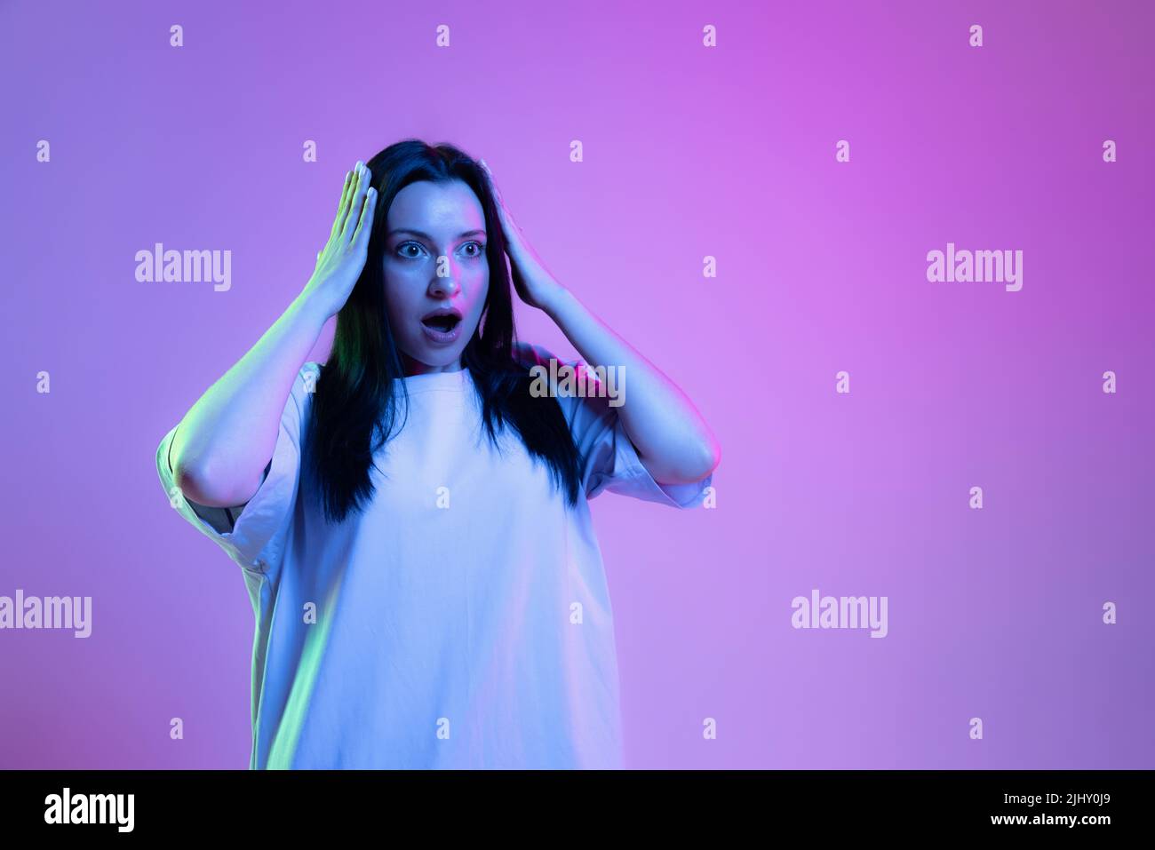 Beautiful scared girl, young woman with long glossy dark hair isolated ...