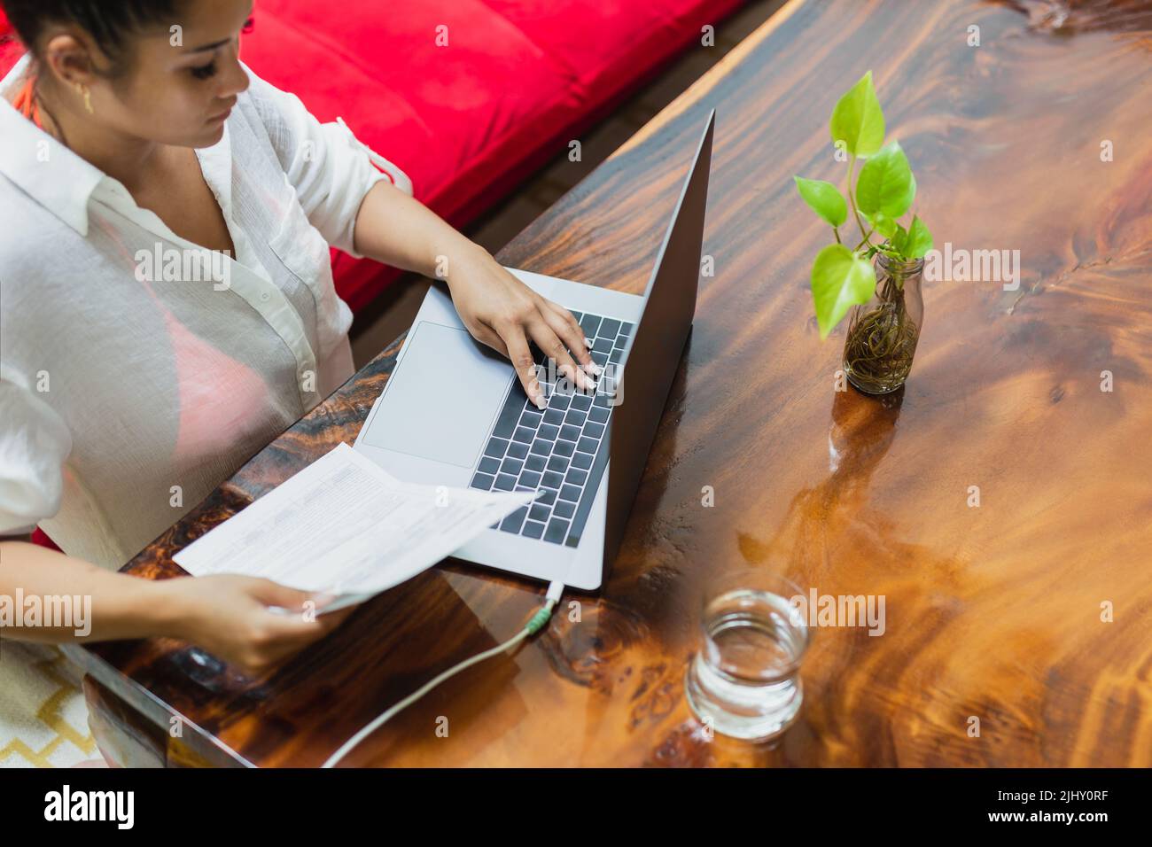 Young woman reading paper letter of university test result Stock Photo ...