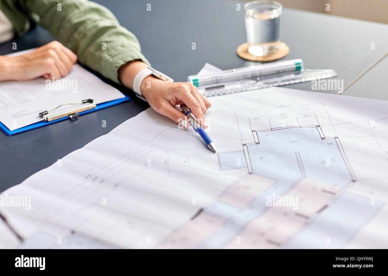 architect with blueprint working at office Stock Photo - Alamy
