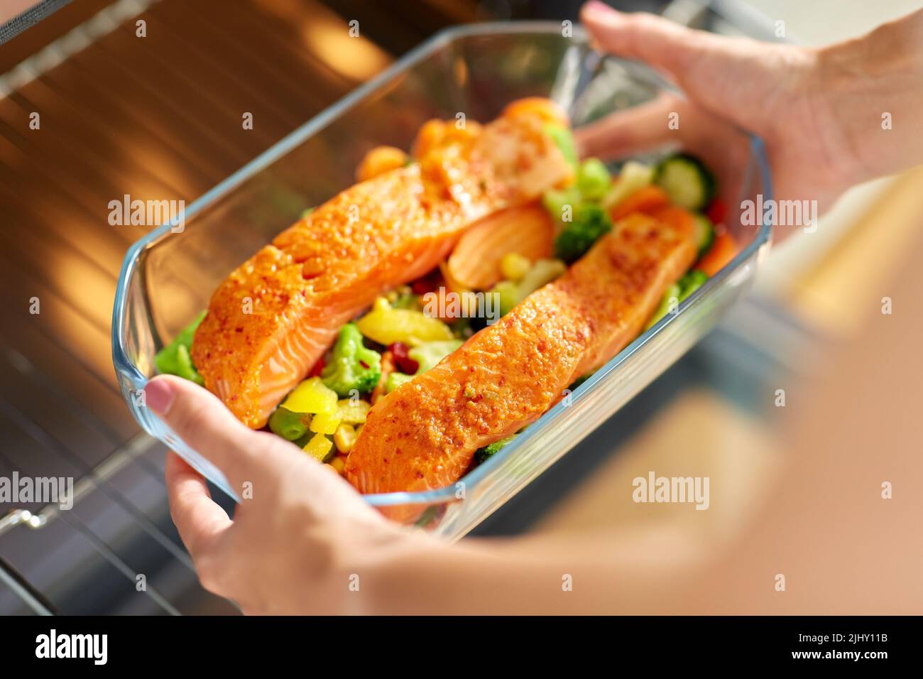 woman cooking food in oven at home kitchen Stock Photo - Alamy