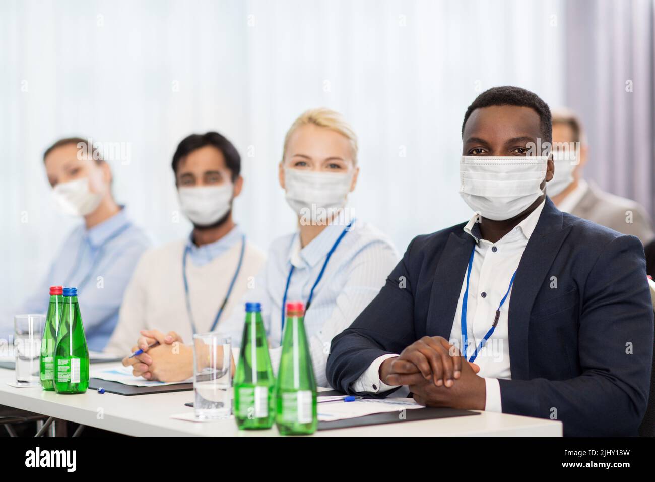 business people in masks at worldwide conference Stock Photo - Alamy