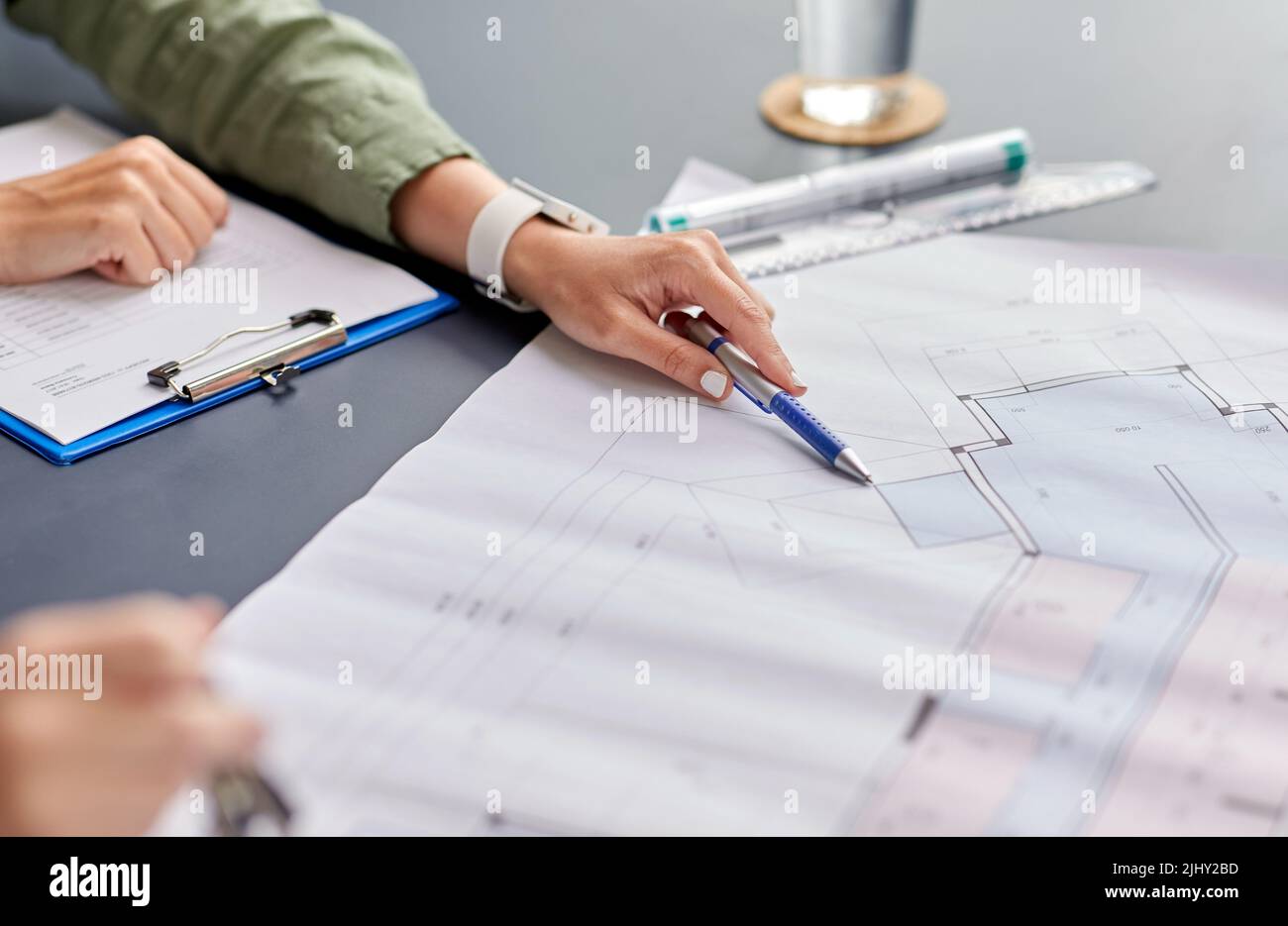 architect with blueprint working at office Stock Photo - Alamy