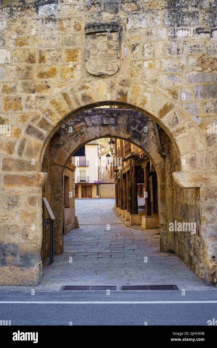 Entrance arch in the medieval wall of the small picturesque village of ...