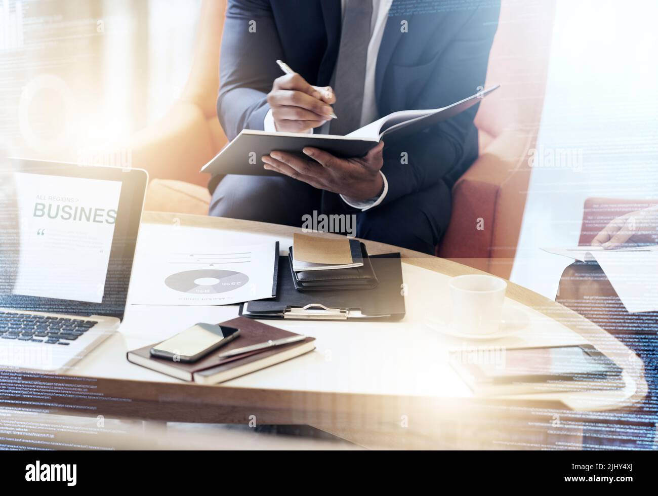 Group of diverse business people with laptops and notepads having a ...