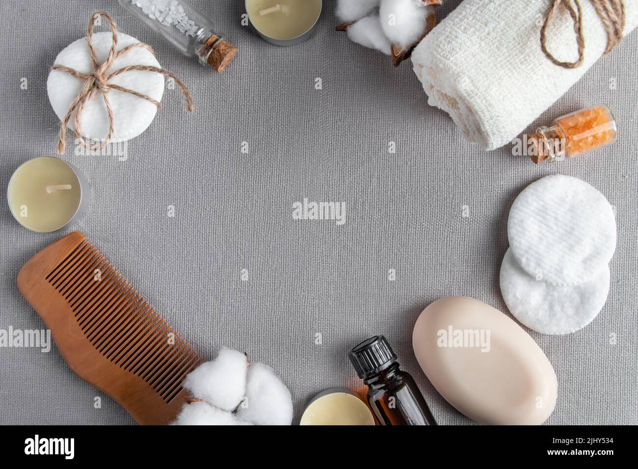 Spa accessories and cosmetics on gray texture background. Towel, soap ...