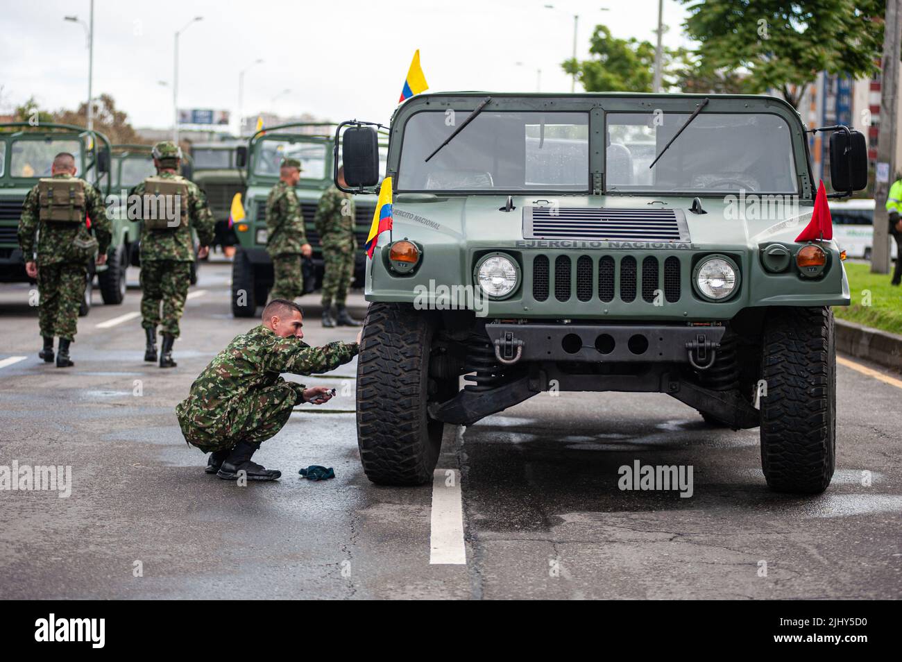 A soldier cleans the wheels of a Humvee vehicle during the 212 years of ...