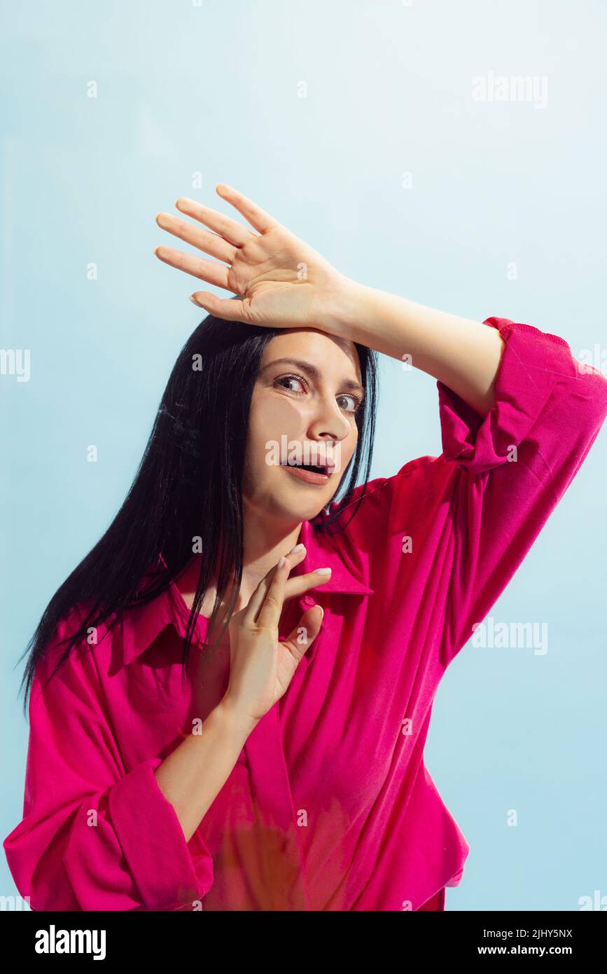 Young pretty girl, student leaned against transparent glass isolated on ...