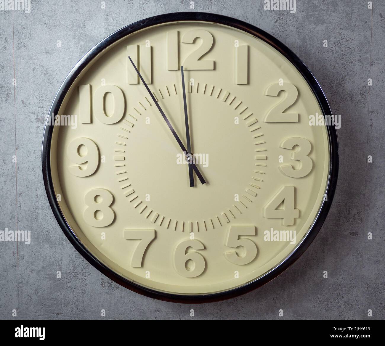 Wall clock on a gray background. Clock close-up. Watch face with large ...