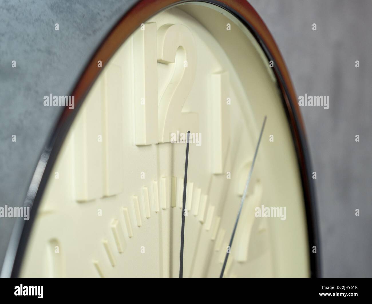 Wall clock on a gray background. Clock close-up. Watch face with large ...