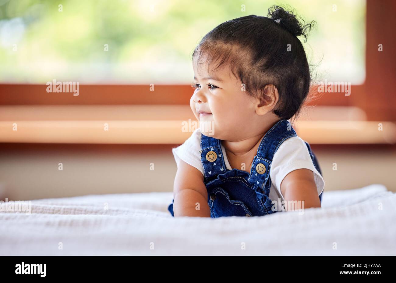 Baby girl bed house smiling house Stock Photo - Alamy