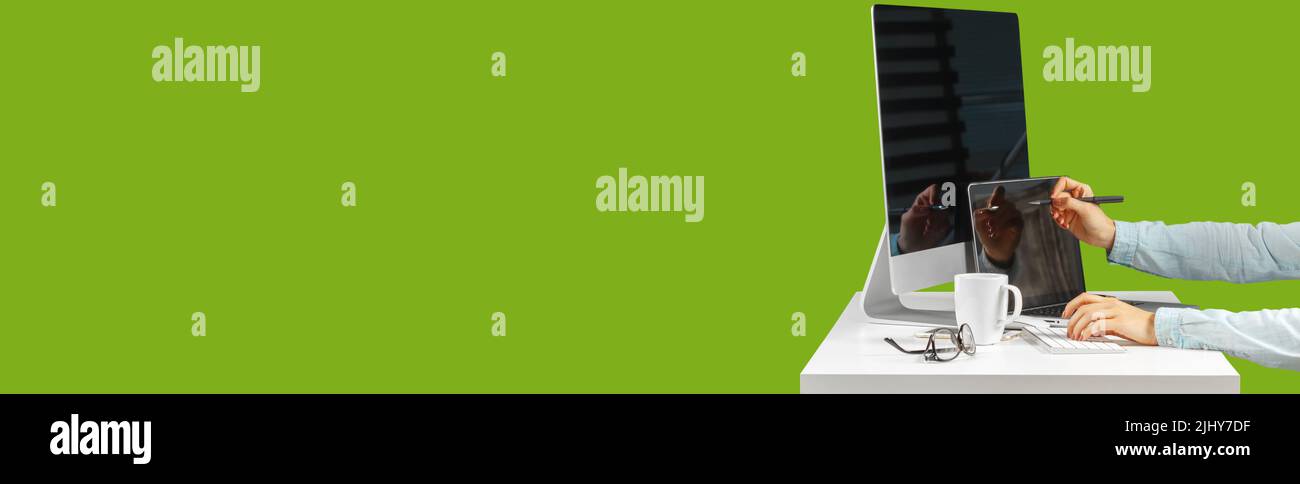 Young woman sitting at the table with open netbook computer. Female ...