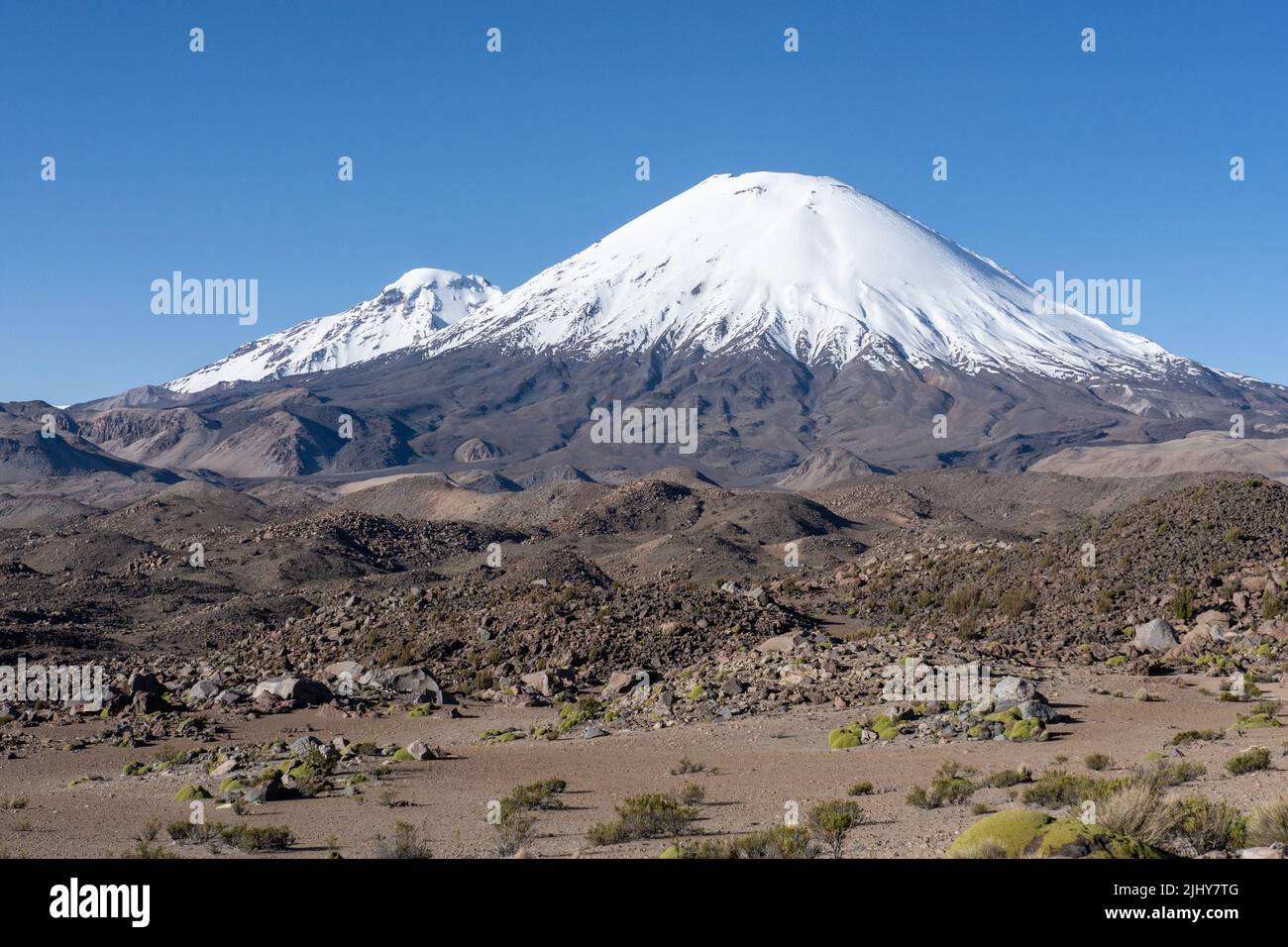 Volcanic debris from the Parinacota (front) and Pomerape Volcanos, the ...