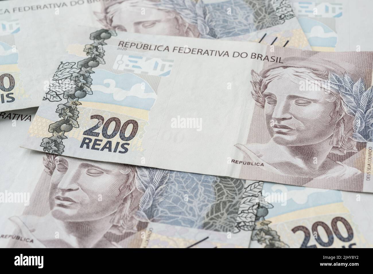 A group of two hundred brazilian real bills spread Stock Photo - Alamy