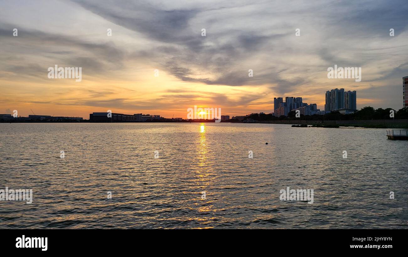 A mesmerizing sunset view over Singapore, Pandan in summer Stock Photo ...
