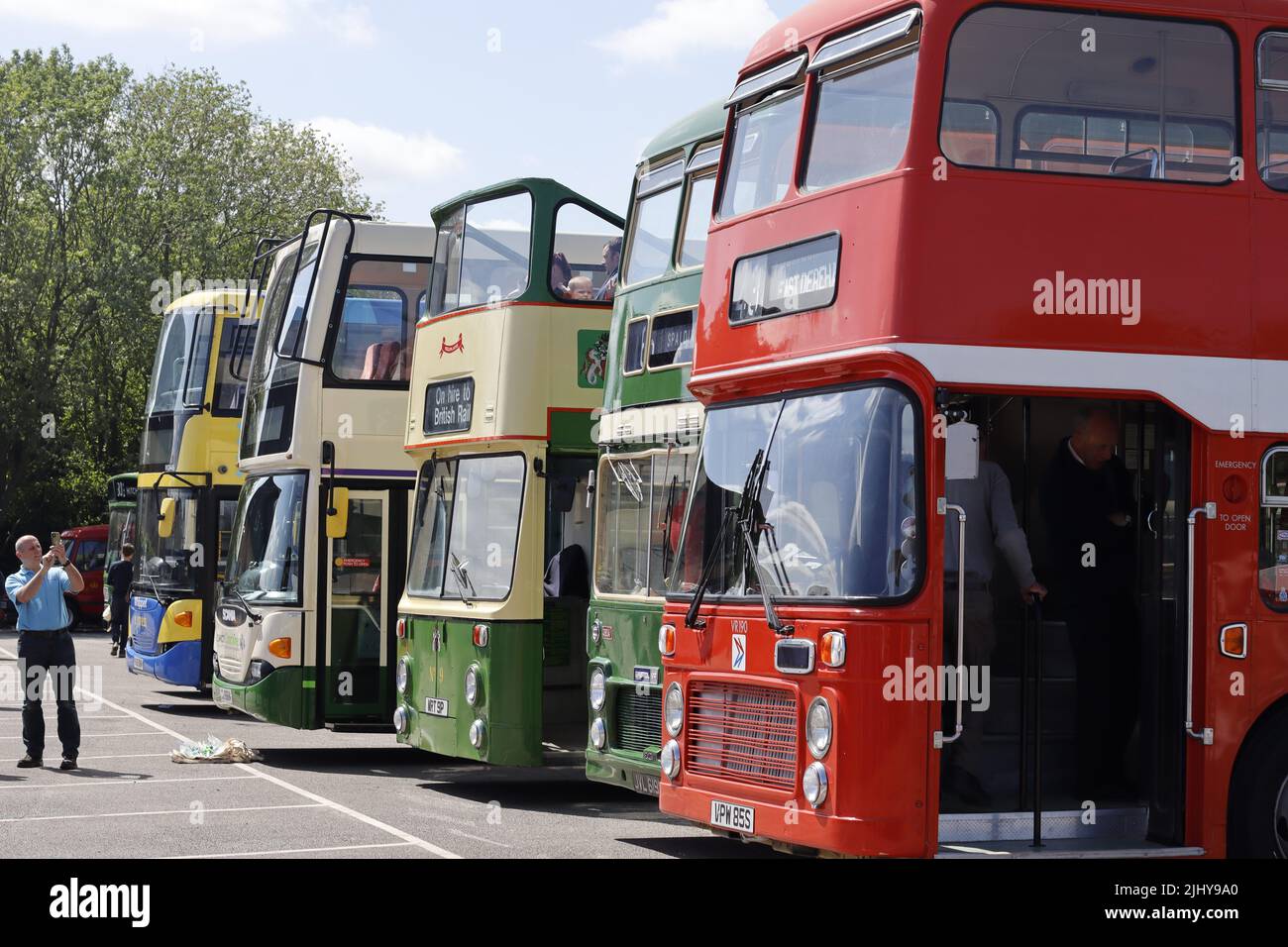 Five colorful double-deck buses parked at Dereham train station ...