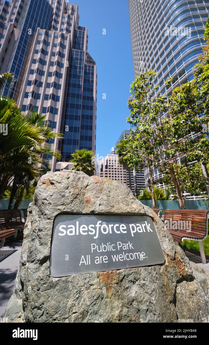 An entrance sign embedded to a rock. In the public greenspace ...