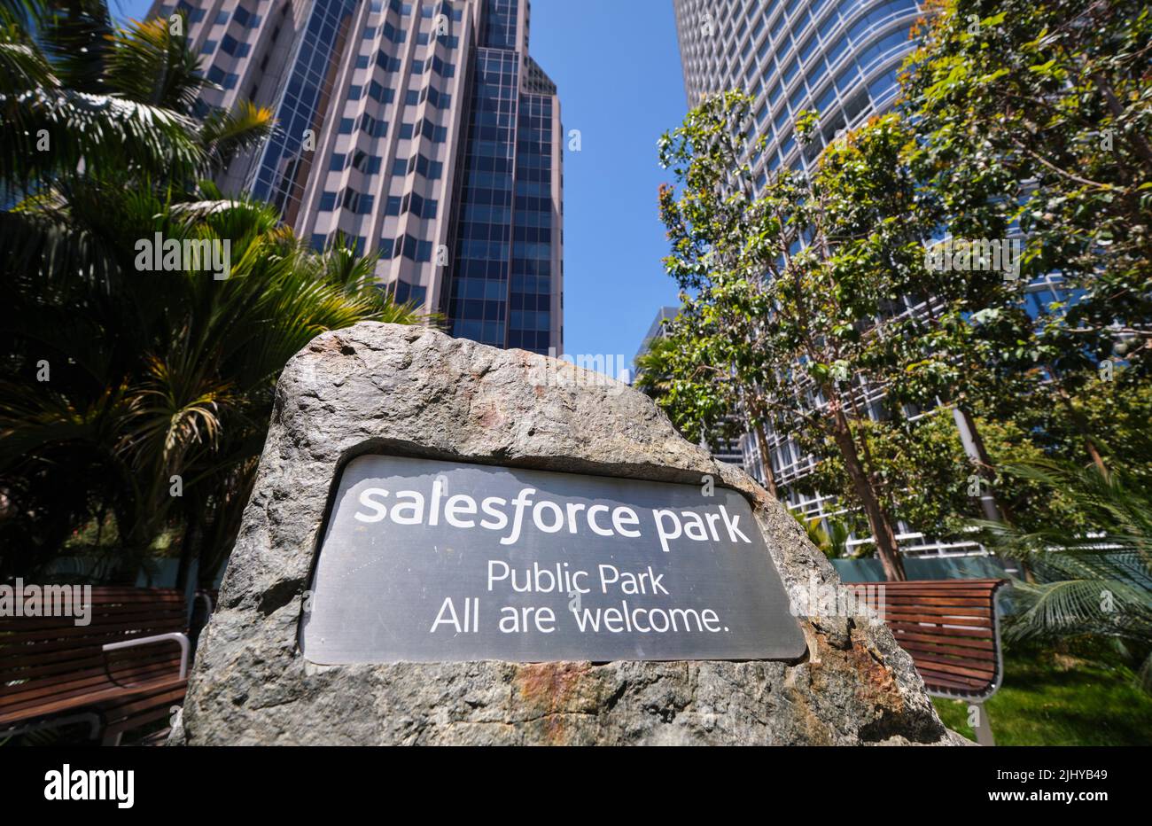 An entrance sign embedded to a rock. In the public greenspace ...