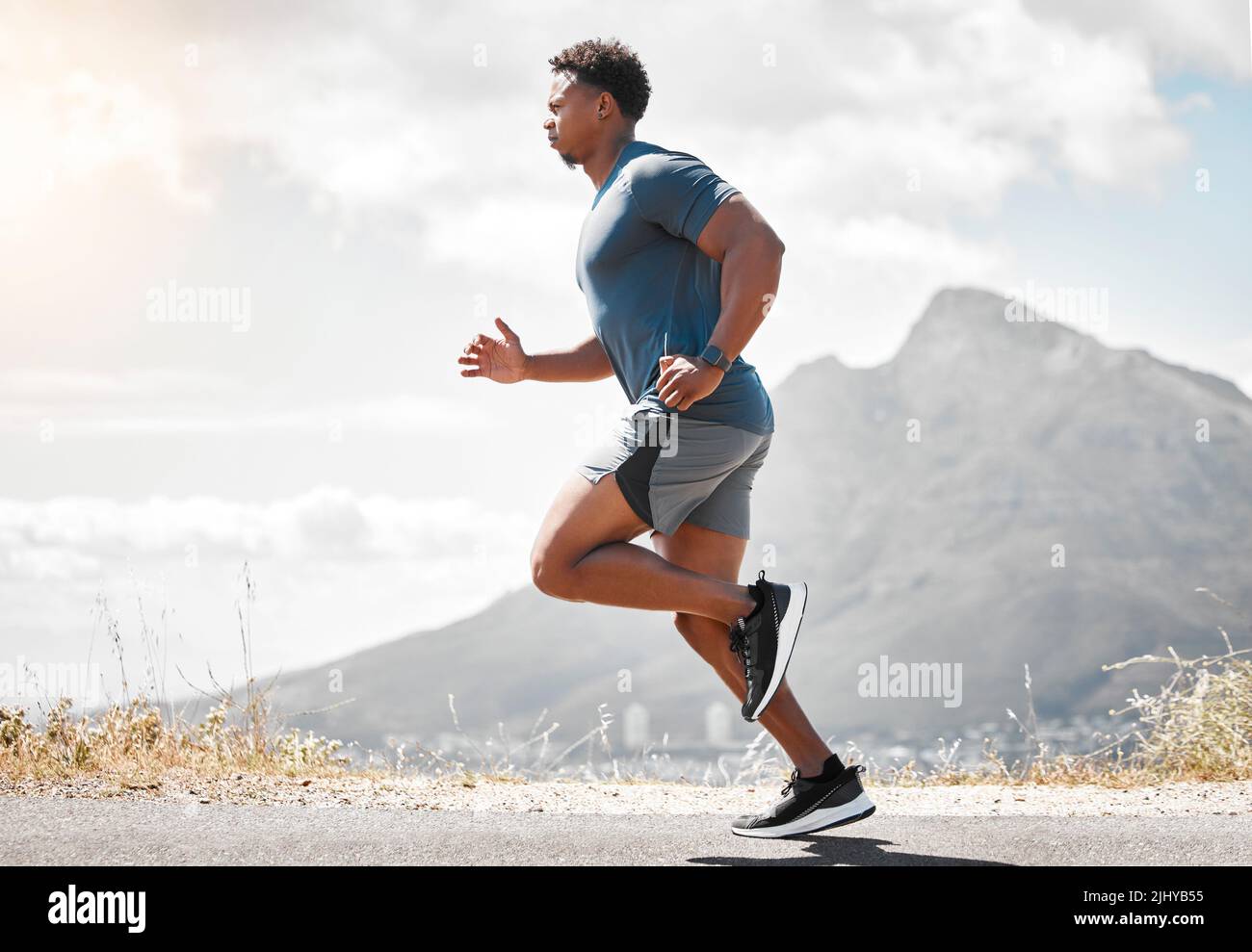 Limits dont apply to me. a handsome young man running alone outdoors ...