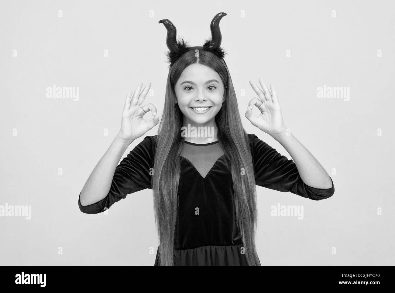 happy witch devil kid show ok gesture wear imp horns costume on ...
