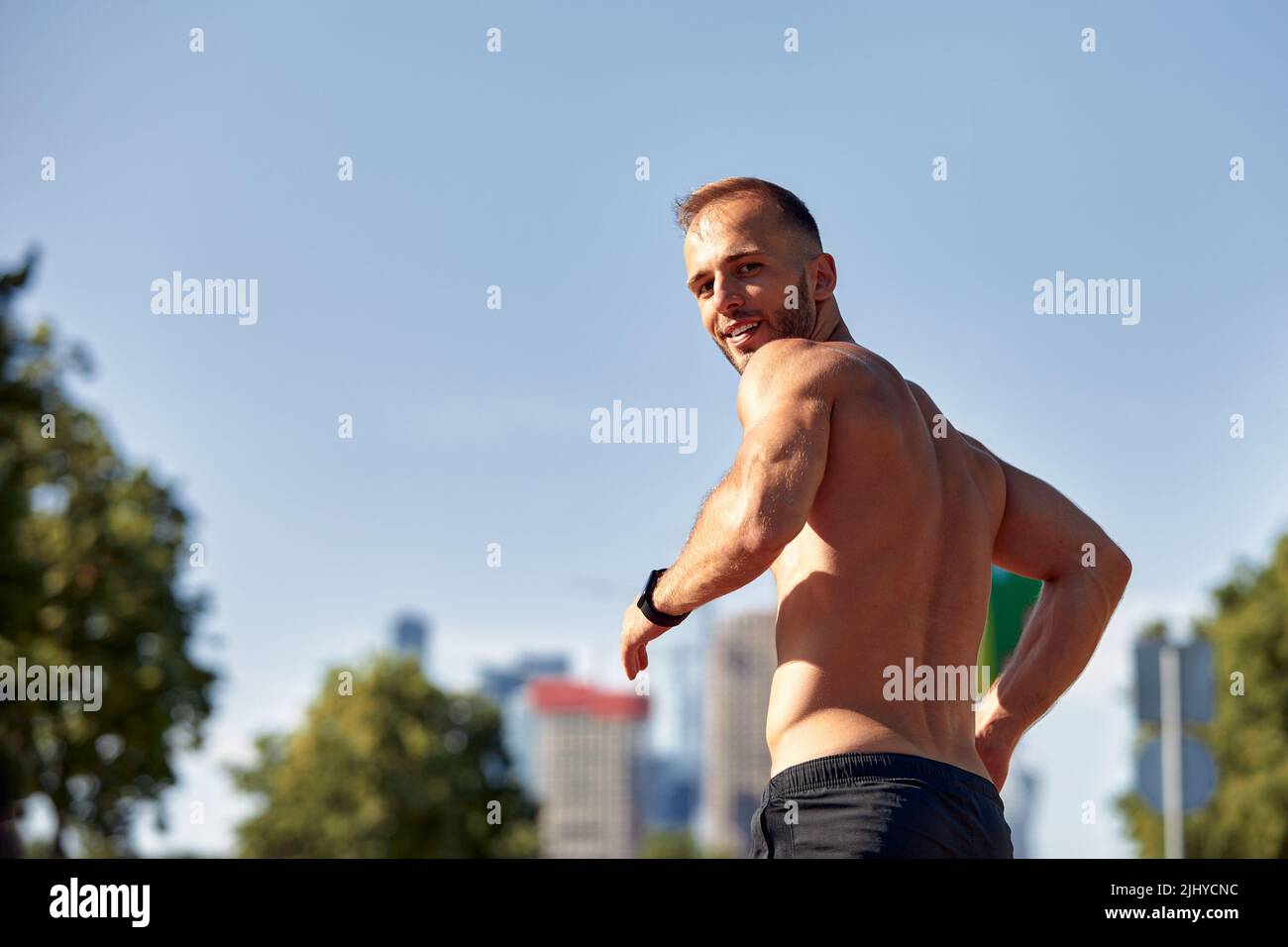 Caucasian man jogging on the running track - Blonde male athlete in ...