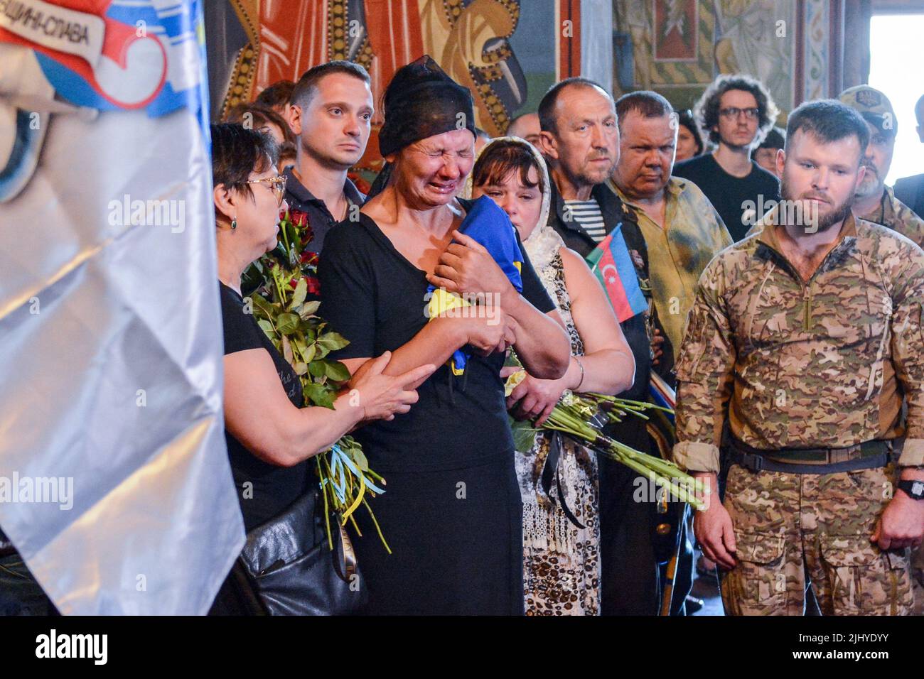Kyiv, Ukraine. 21st July, 2022. A mother cries and holds a Ukrainian ...