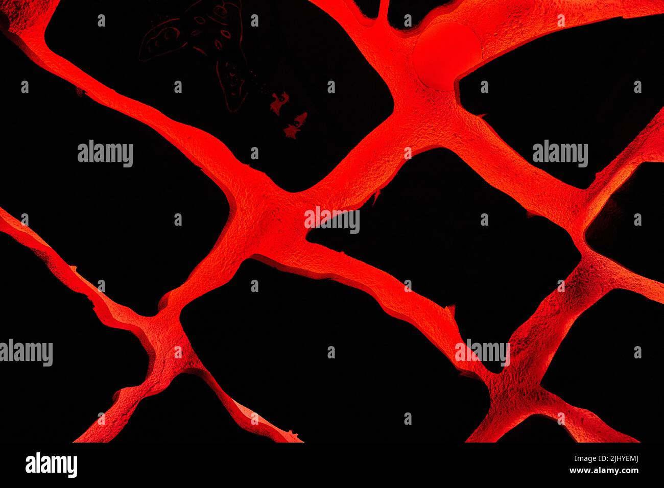 Display of red lava veins through rocks Stock Photo - Alamy