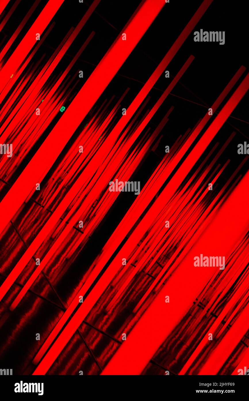 Angle of red neon light poles very abstract Stock Photo - Alamy