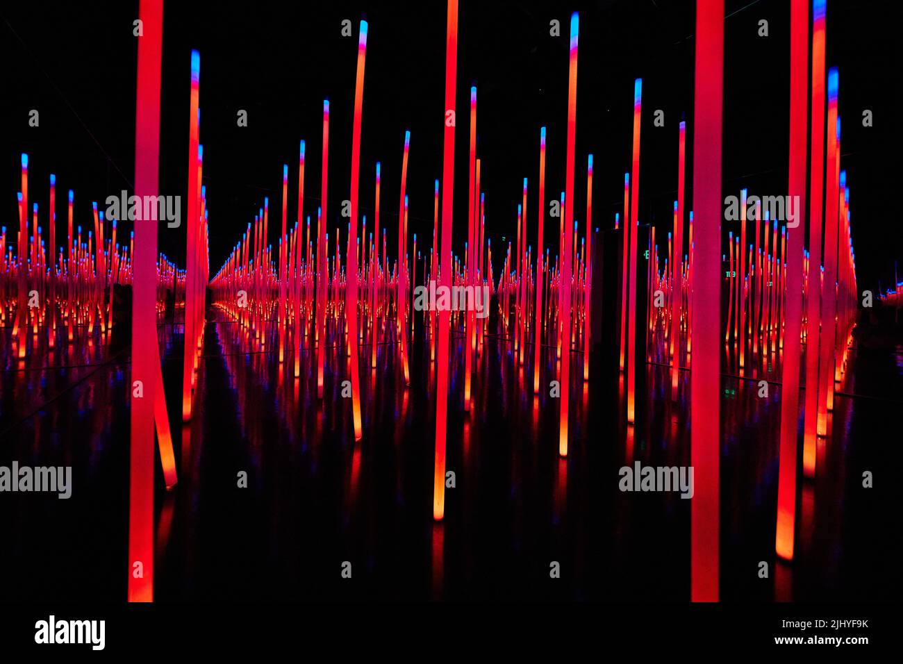 Abstract red LED light poles in infinity mirror room Stock Photo - Alamy