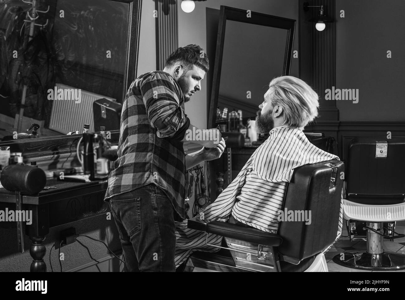 Trimming beard. Barbershop services. Excellent barber does not rush ...