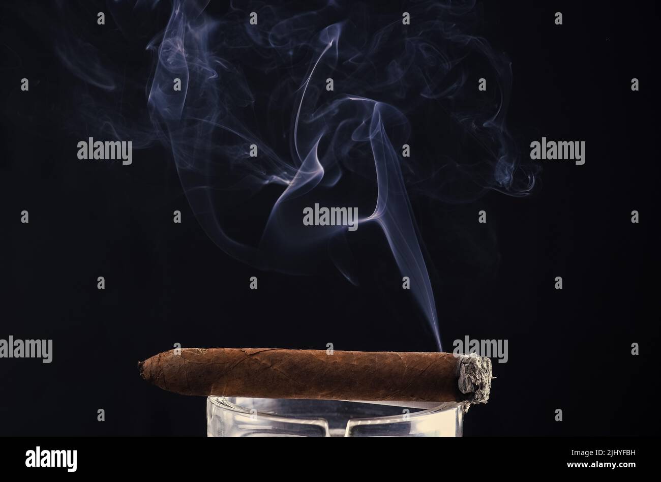 Steaming cuban cigar with smoke puff dark background, smoking Stock ...