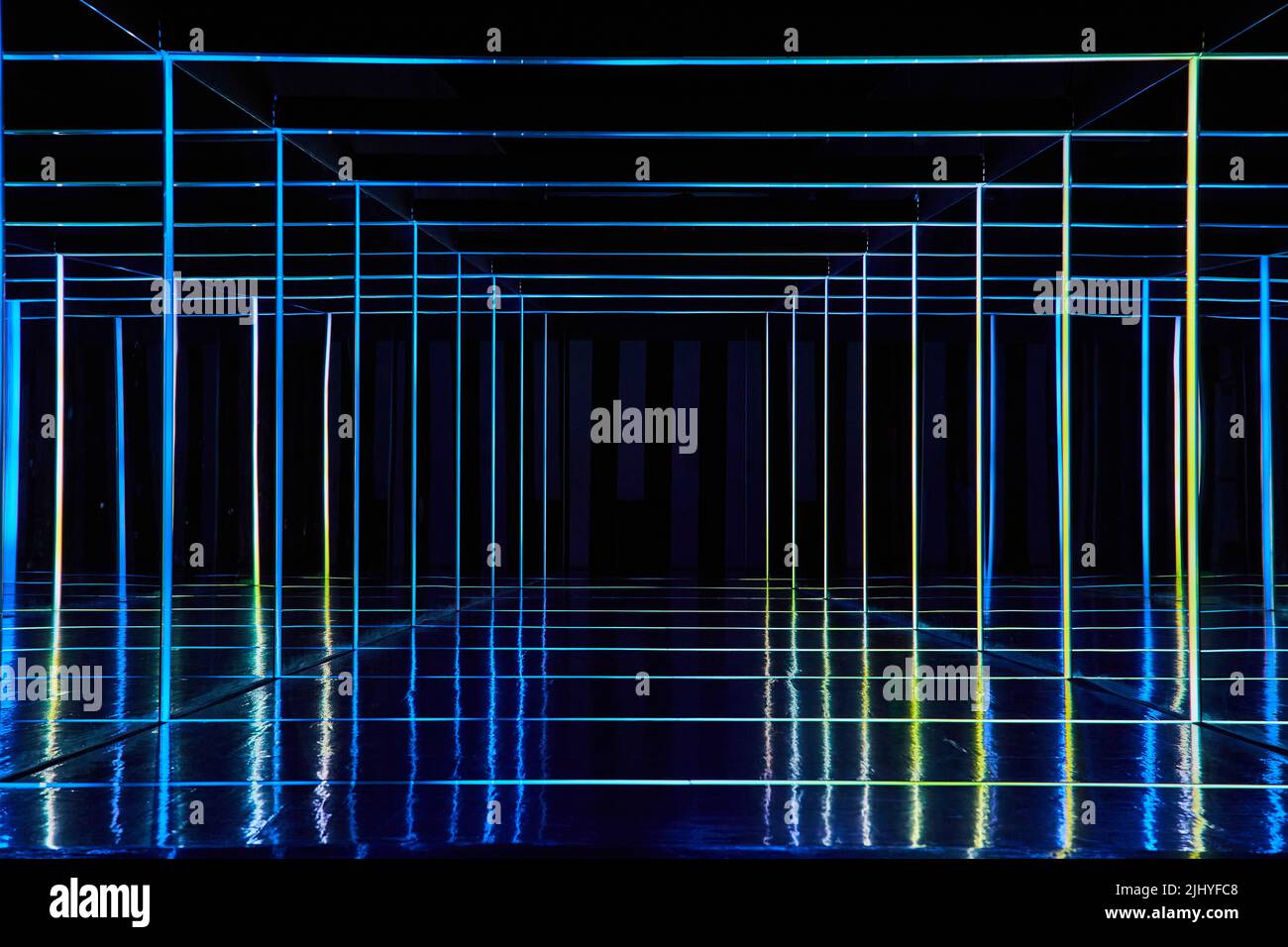 Colorful neon lights lining mirror hallway of infinity Stock Photo - Alamy