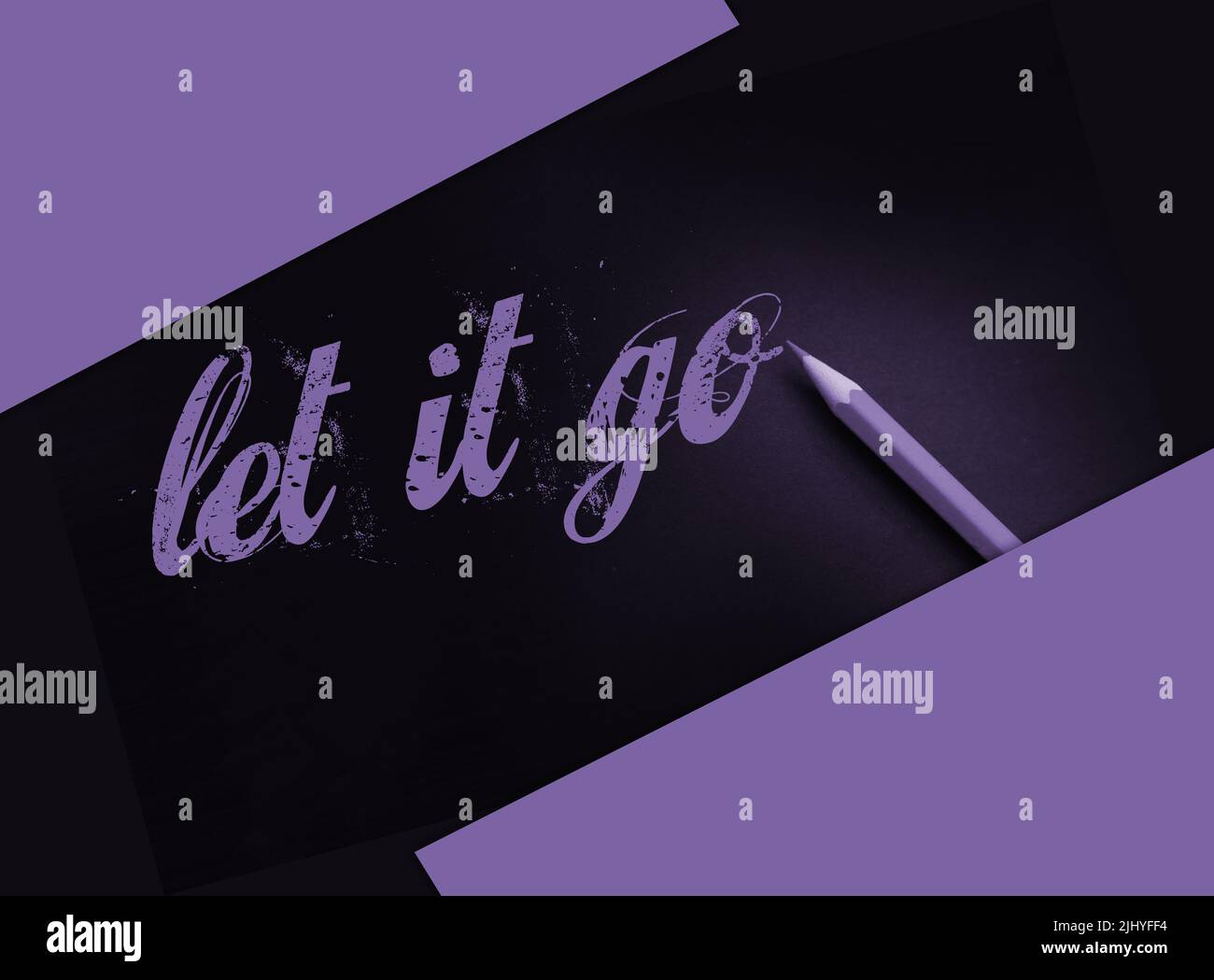 Let it go words written with a yellow pencil on black. Forgiveness ...