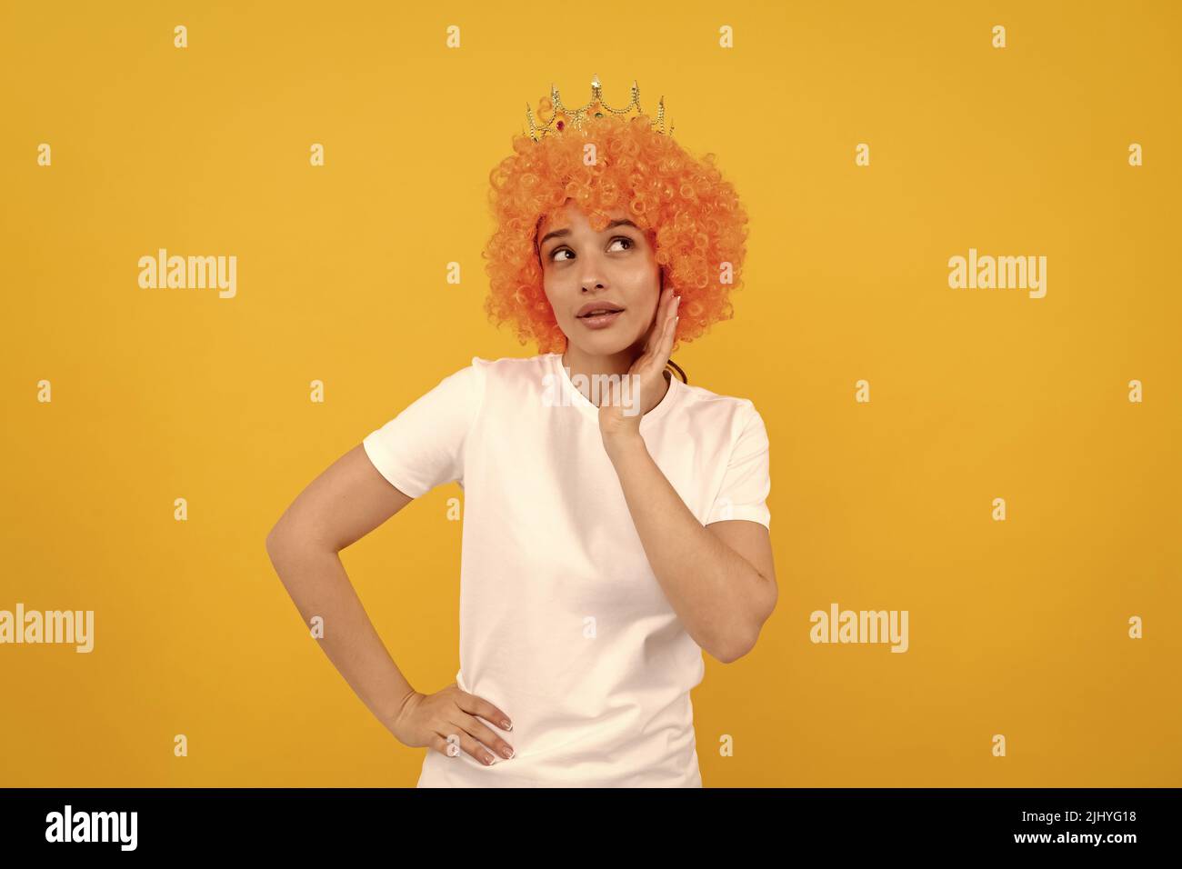 posing for photo. egocentric woman in clown wig and crown. imagine ...